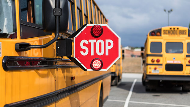 ASK A COP — Can school buses with yellow lights flashing be passed ...